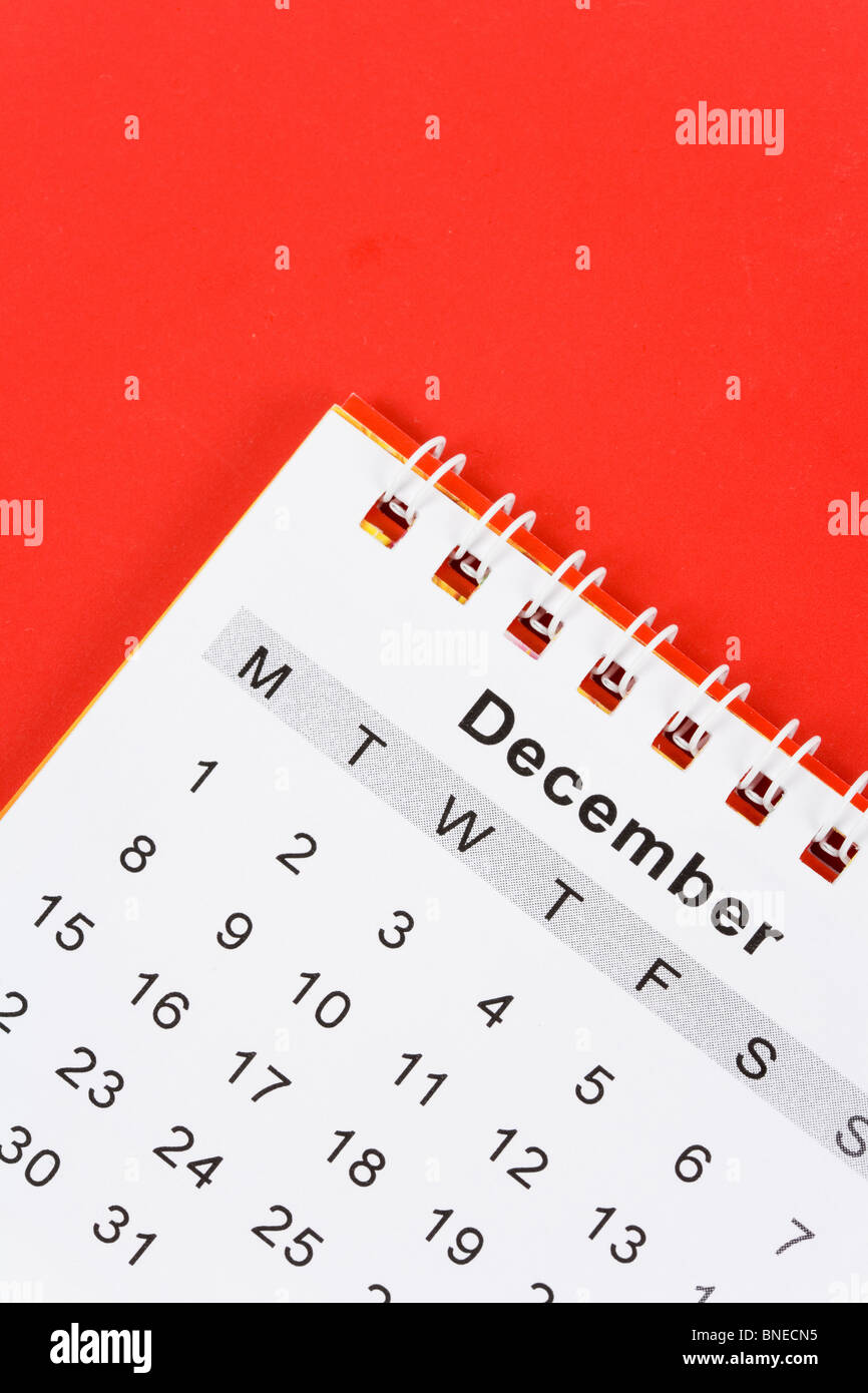 Calendar December close up with red background Stock Photo - Alamy