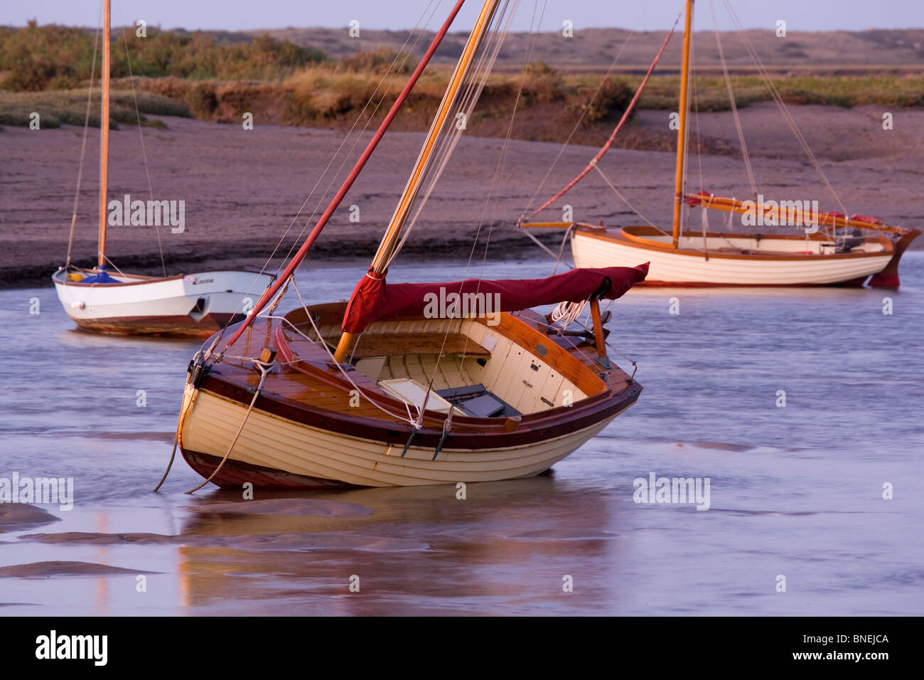 Boats at sunset at Burnham Overy Staithe Stock Photo - Alamy