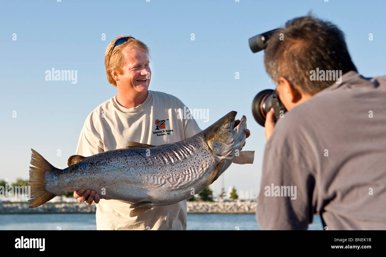 Roger Hellen poses with his 41.5 pound Brown trout that is speculated ...