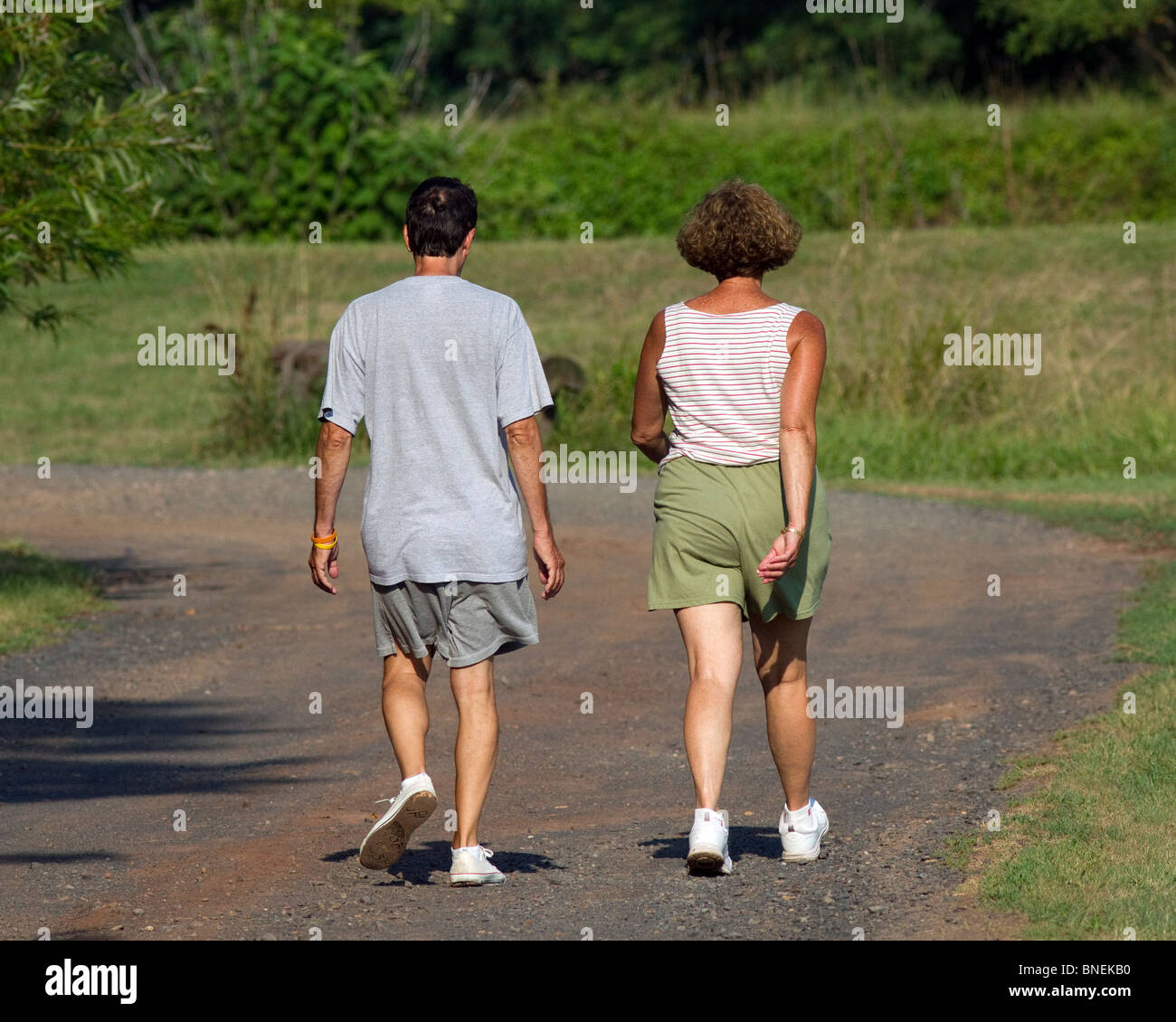 A white Caucasian couple out for an early morning walk Stock Photo - Alamy