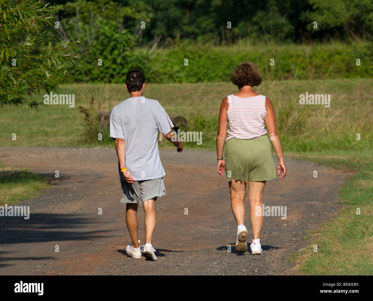 A white Caucasian couple out for an early morning walk Stock Photo - Alamy