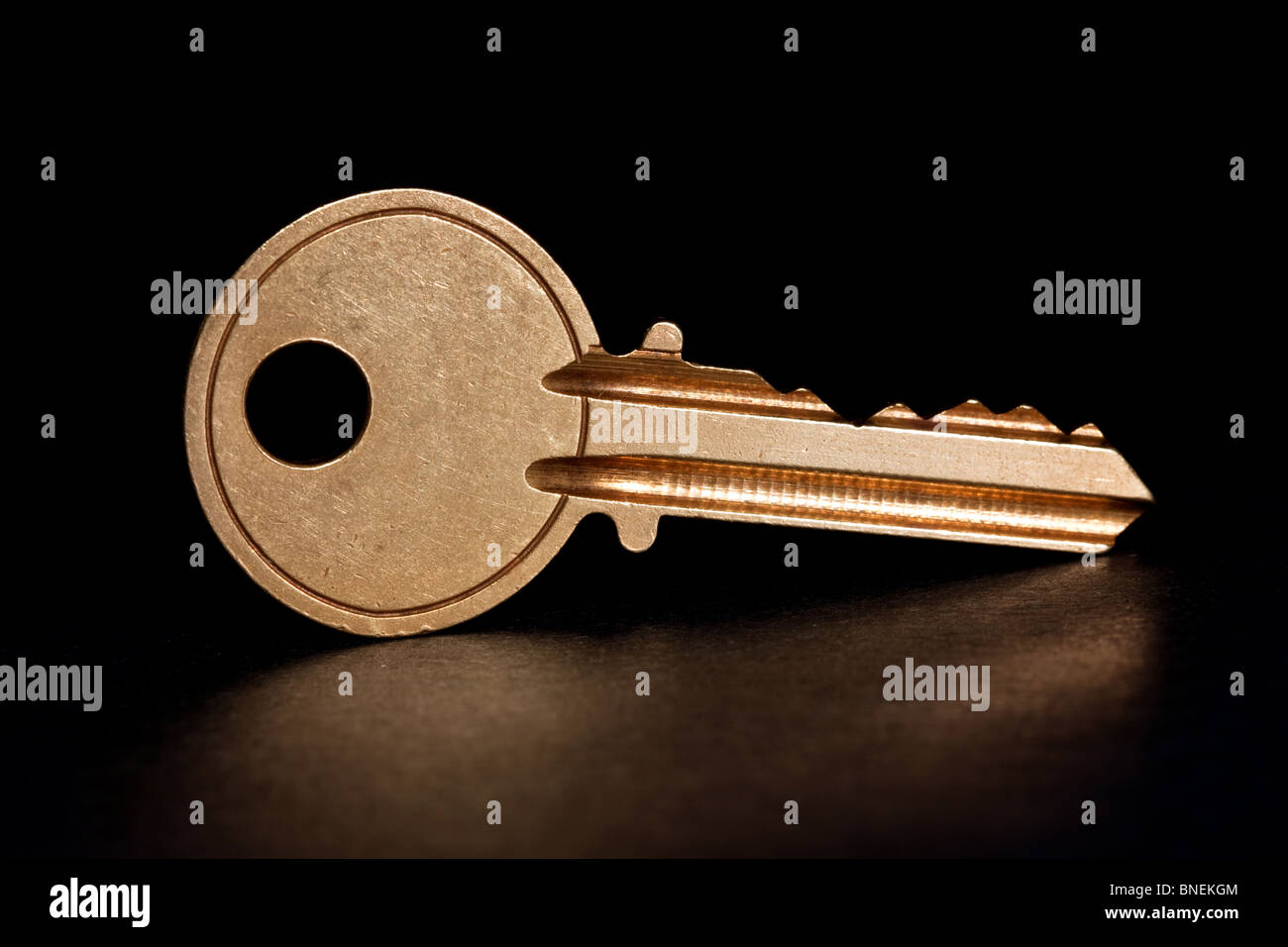 Golden House Key with black background Stock Photo - Alamy
