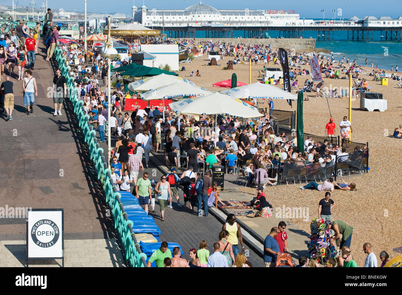 Crowded seafront and pebble beach, Brighton, East Sussex, United ...