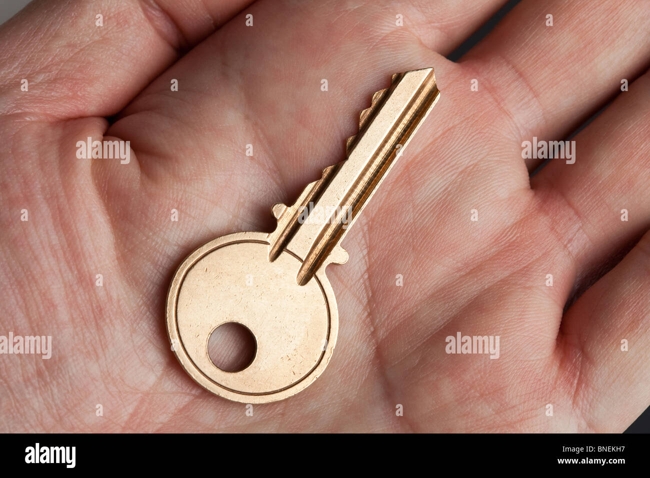 Golden House Key close up Stock Photo - Alamy