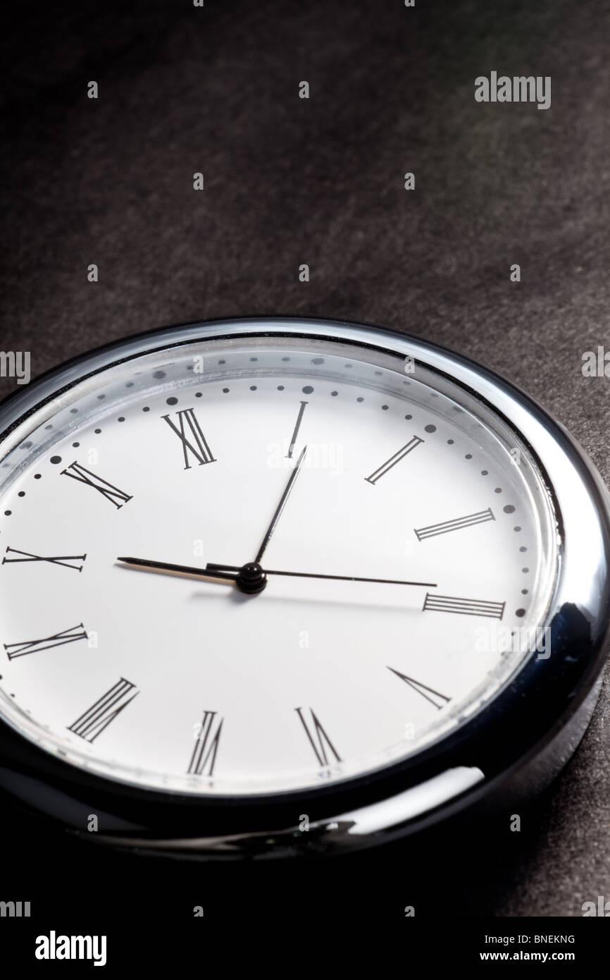 Clock close up with dark background Stock Photo - Alamy