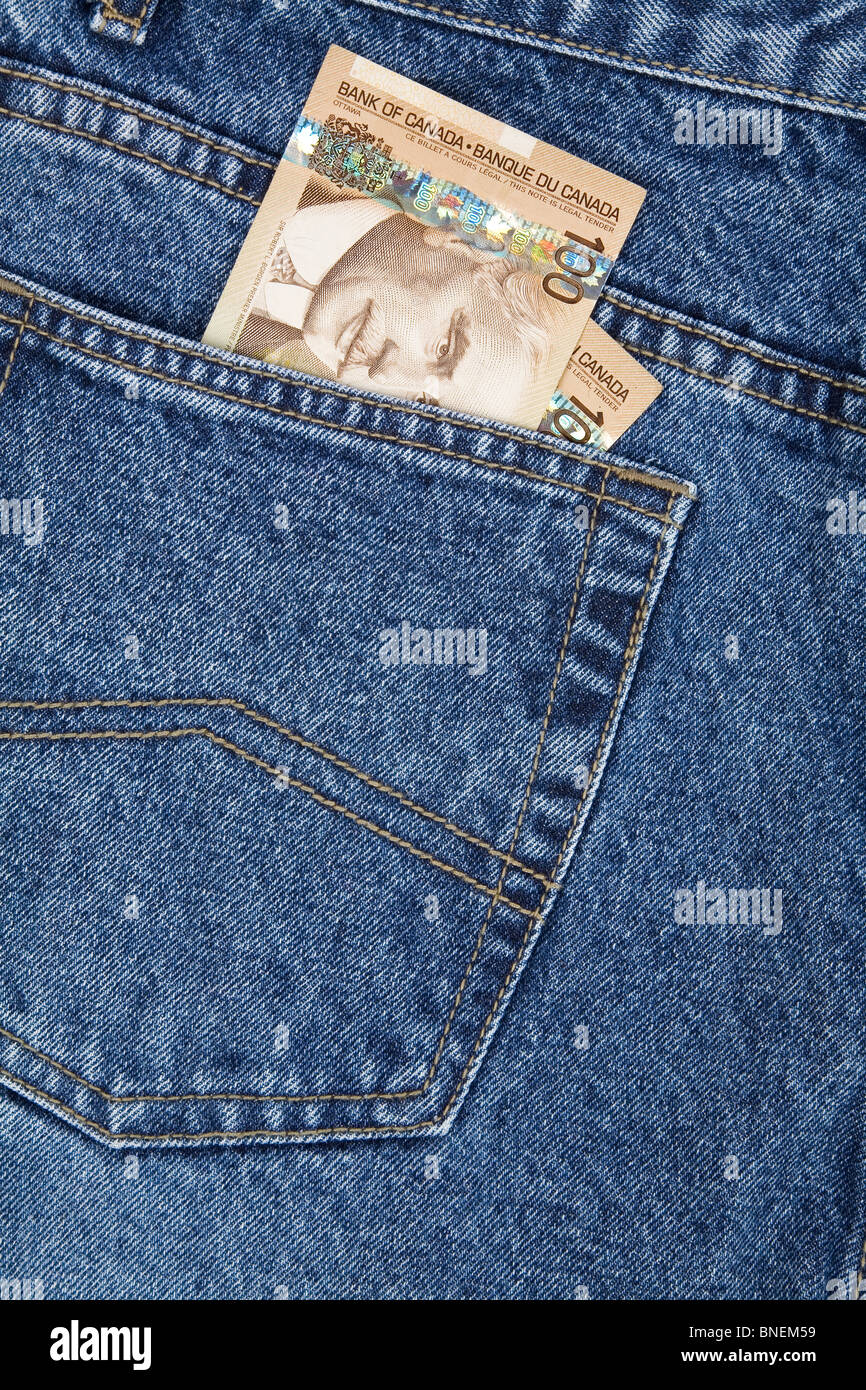 a blue jean and canadian dollars close up shot Stock Photo - Alamy