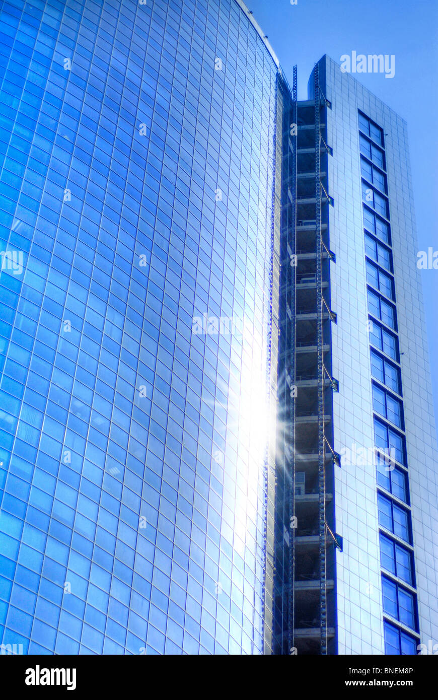 Modern skyscrapers close-up toned in blue color Stock Photo - Alamy