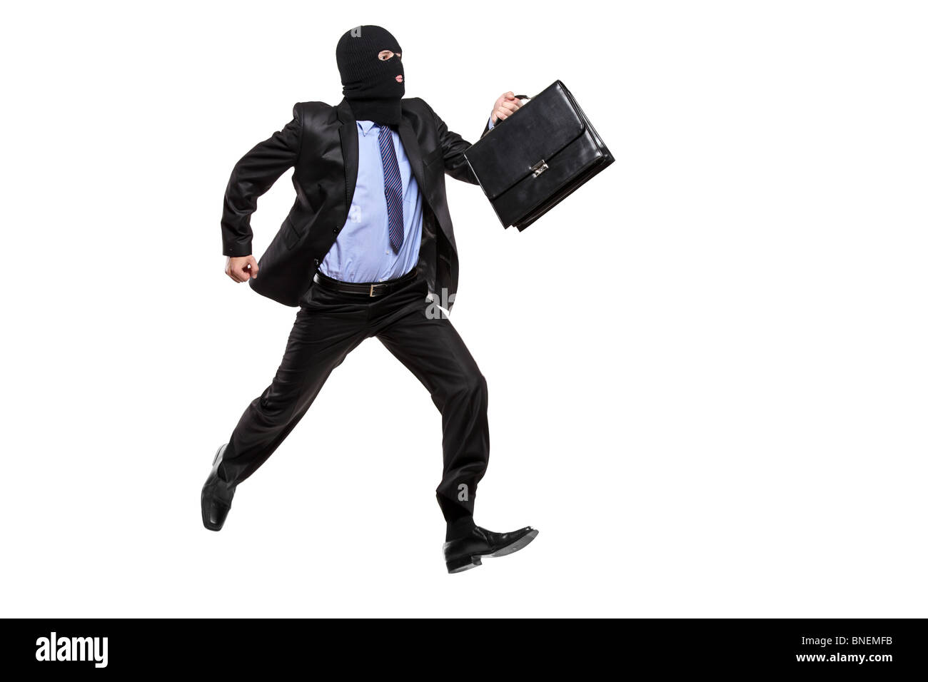 A burglar with robbery mask running away Stock Photo - Alamy