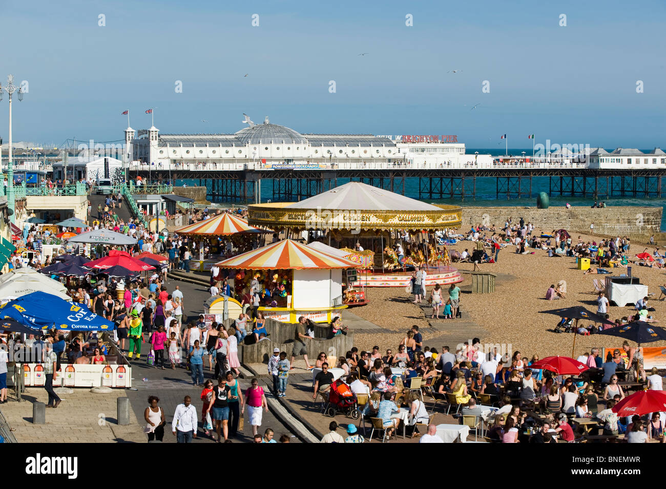 Crowded seafront and pebble beach, Brighton, East Sussex, United ...