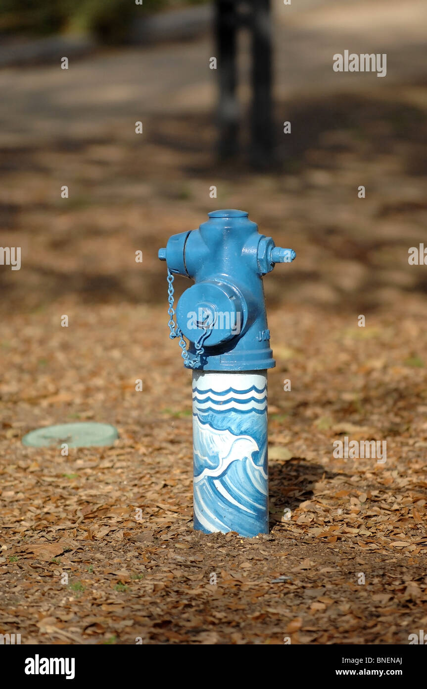 Artistically painted blue fire hydrant with a water theme Stock Photo ...
