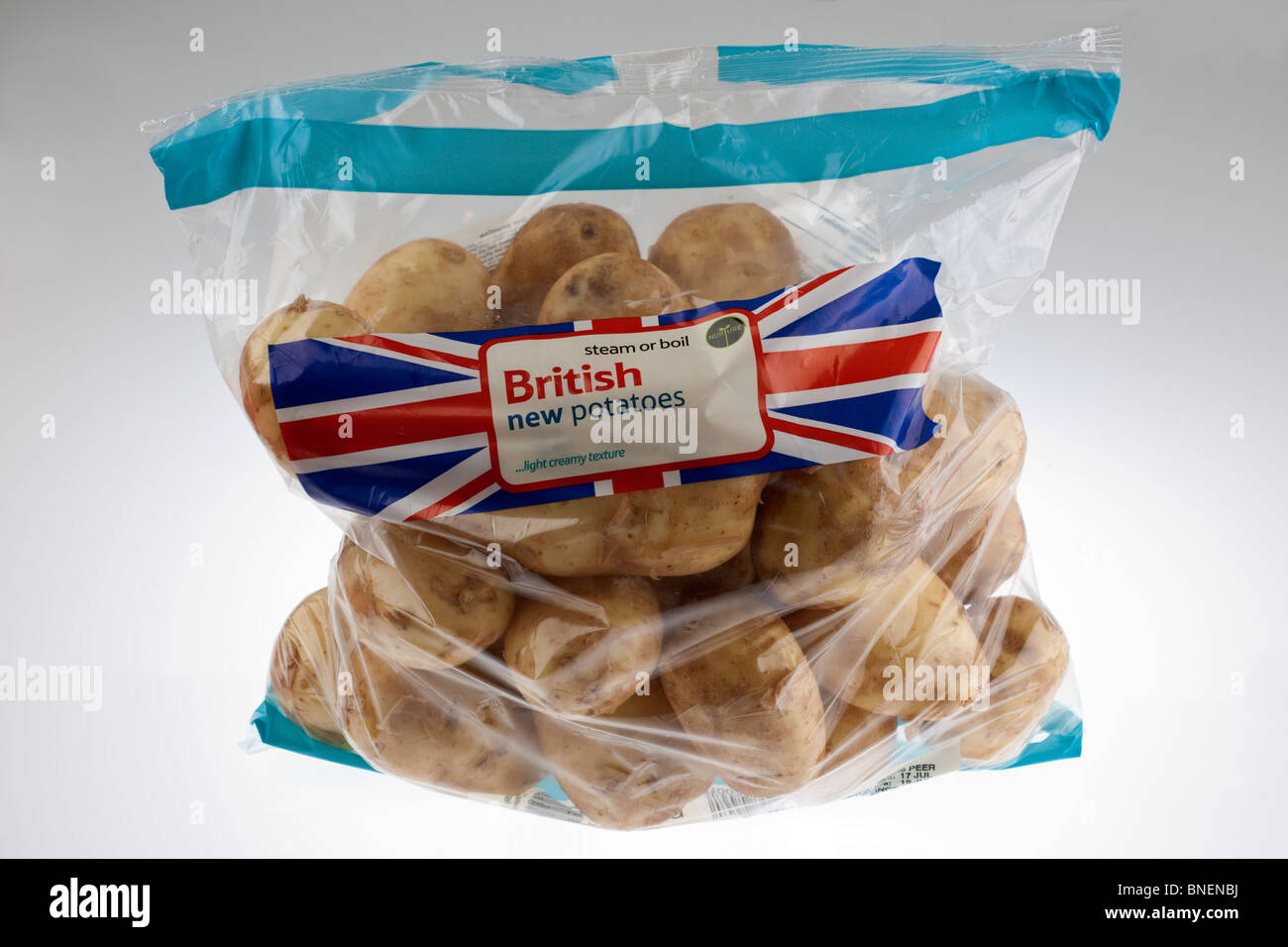Bag of British new potatoes Stock Photo - Alamy