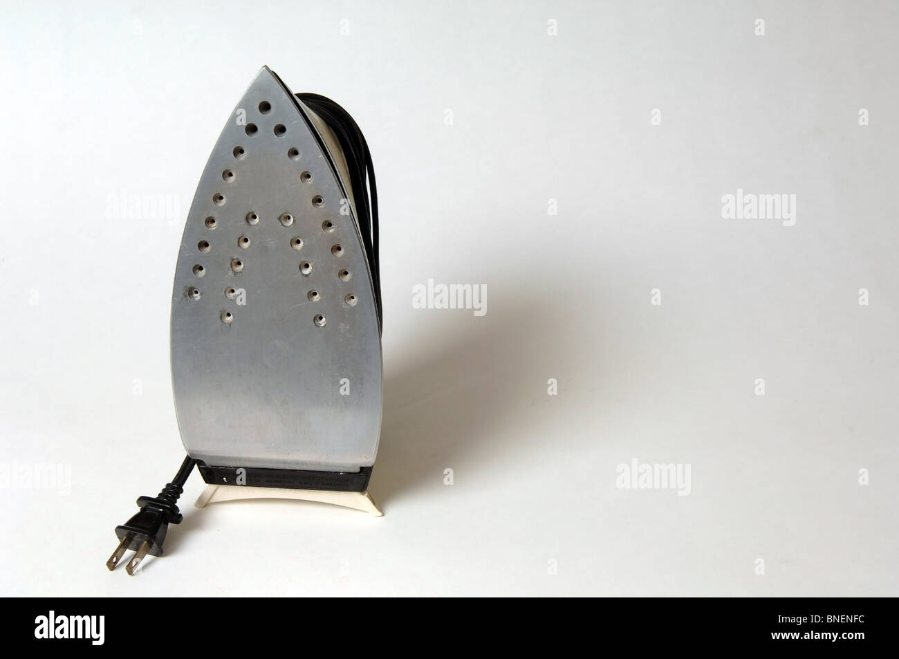 Cut-out of a clothes iron with steam capability on a white background ...