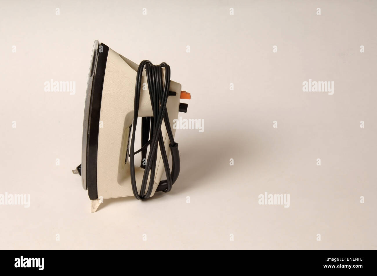Cut-out of a clothes iron with steam capability on a white background ...