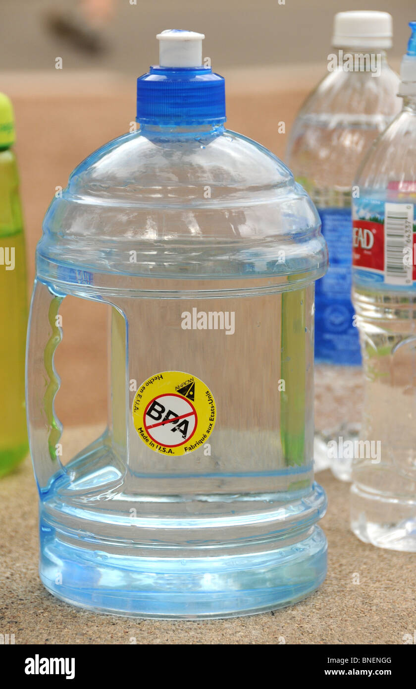 Water bottles sit on a bench during a workout Stock Photo - Alamy