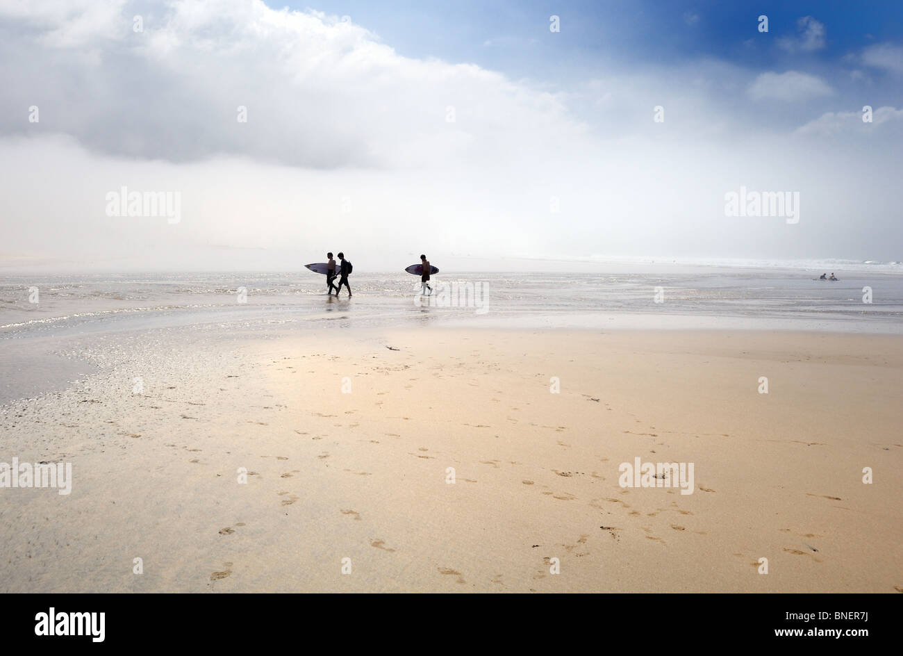 Person walking across sandy beach hi-res stock photography and images ...