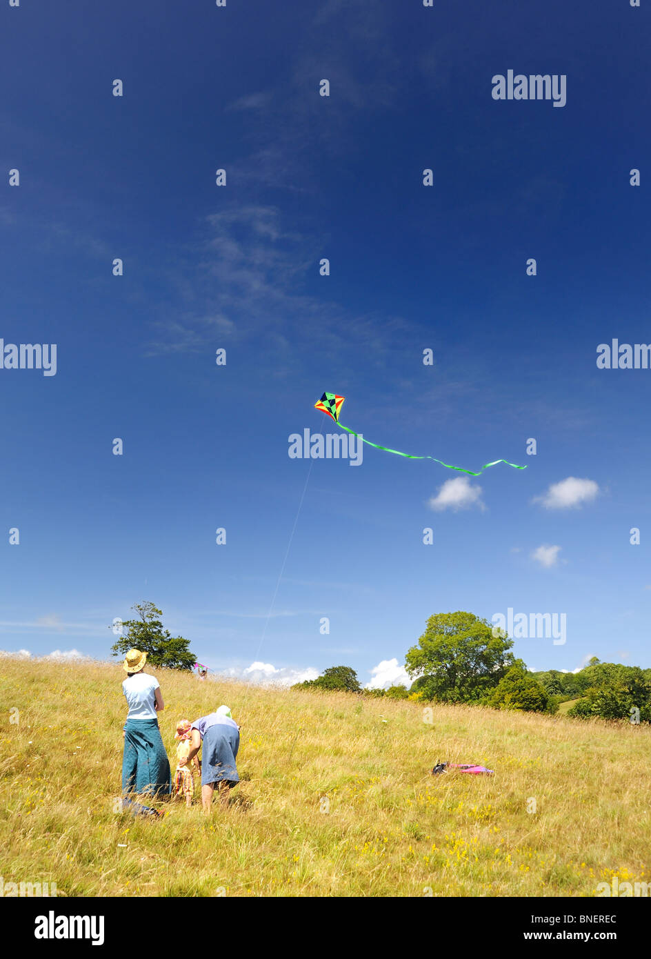 Mother and young child flying a kite Stock Photo - Alamy