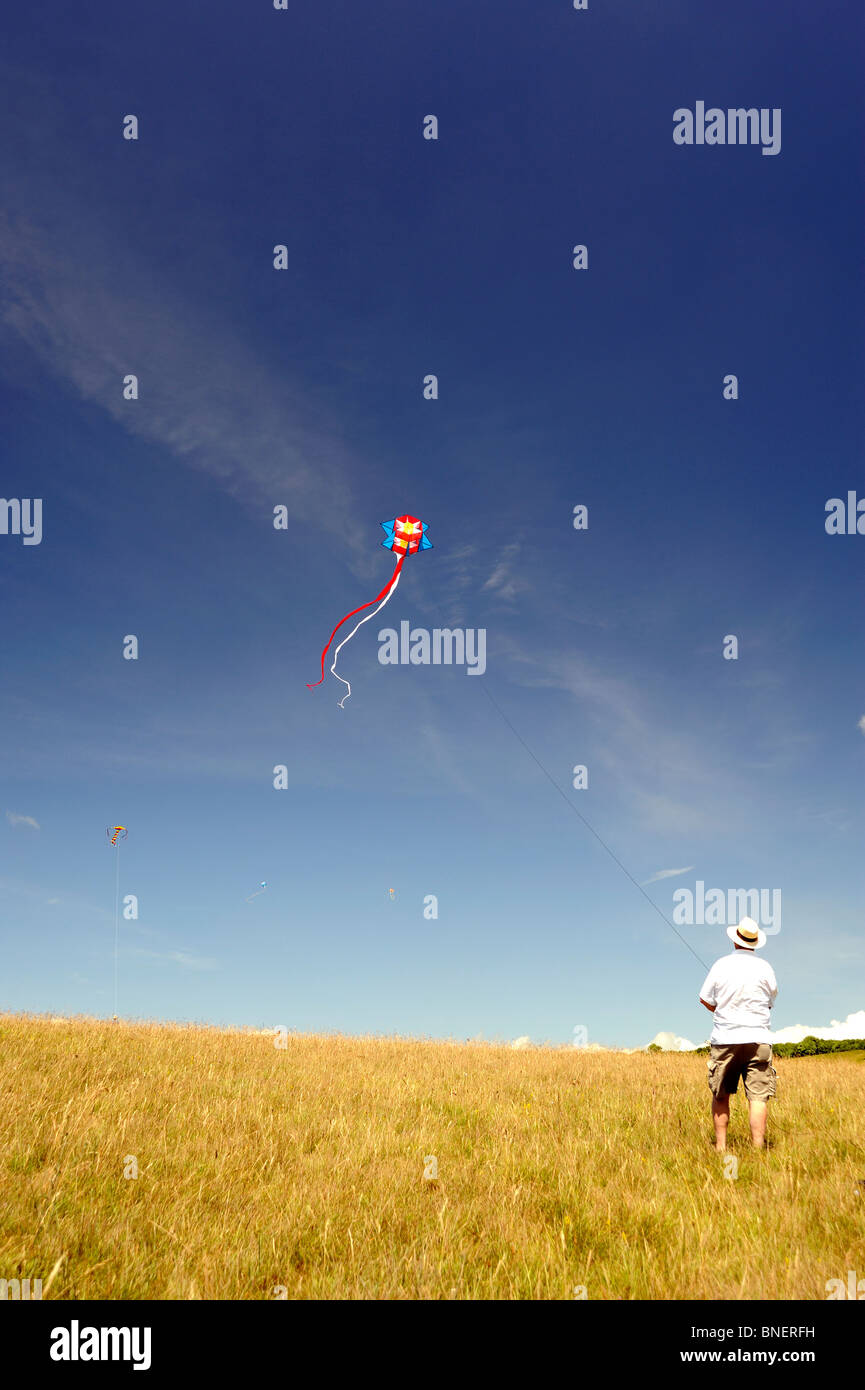 Man flying a kite Stock Photo - Alamy