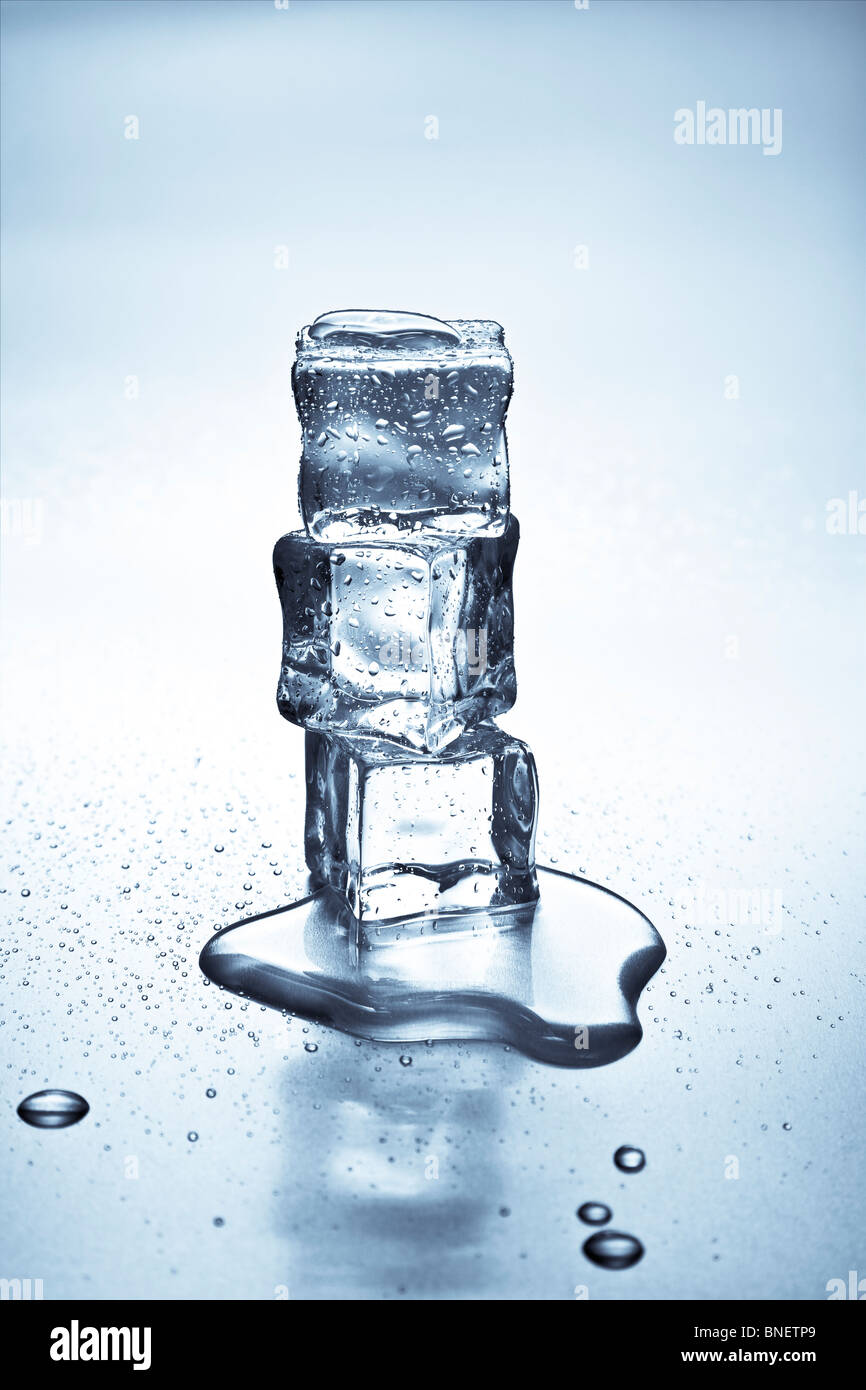 Melting ice cubes on a metal tabletop Stock Photo - Alamy