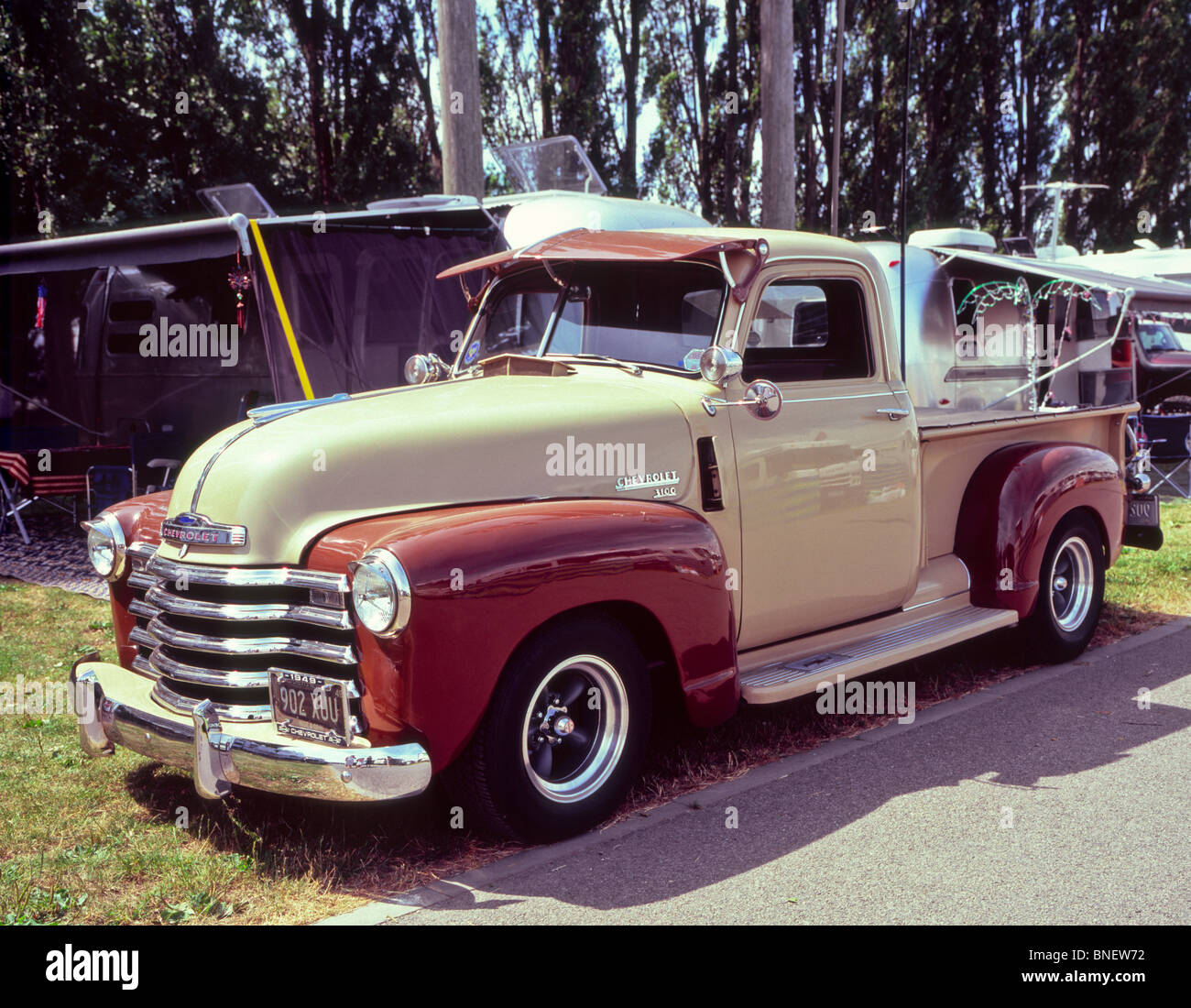 A restored 1950s Chevrolet stepside pick up in cream and brown Stock ...