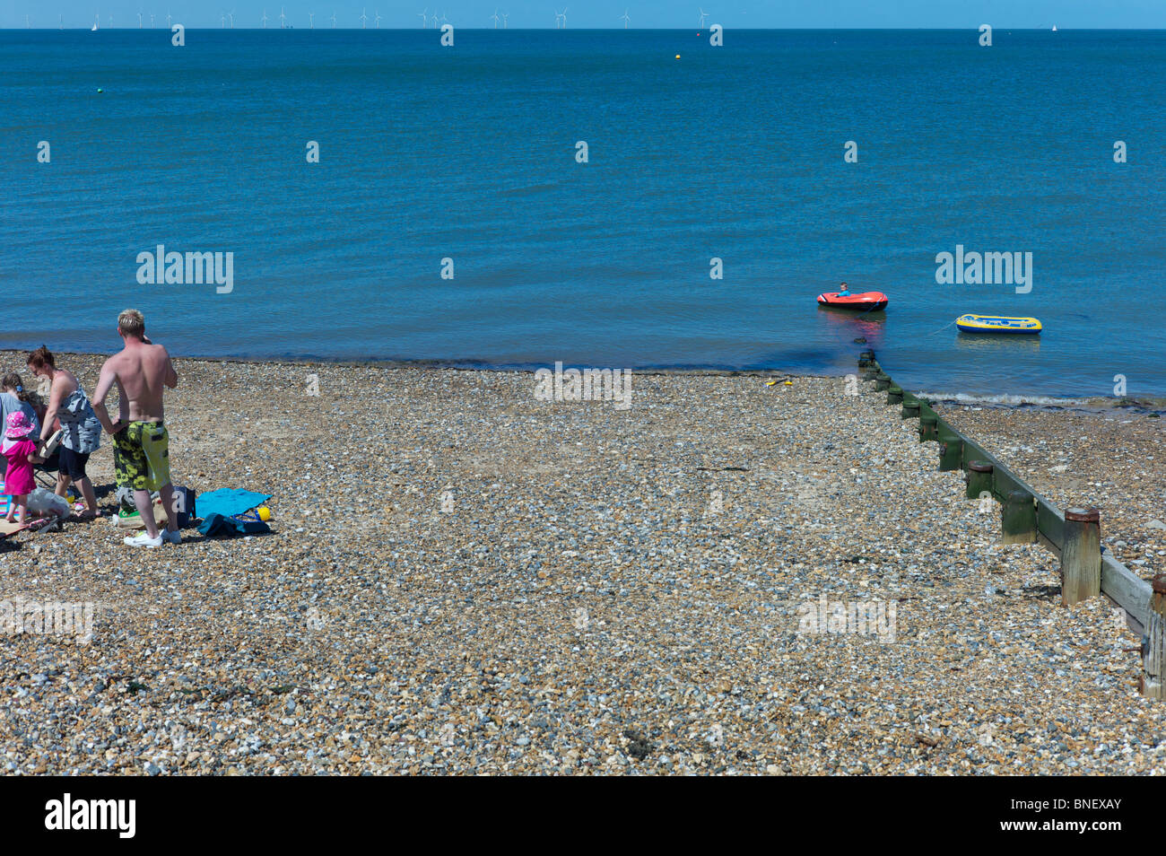 Child in red rubber dingy floating in the sea Stock Photo - Alamy