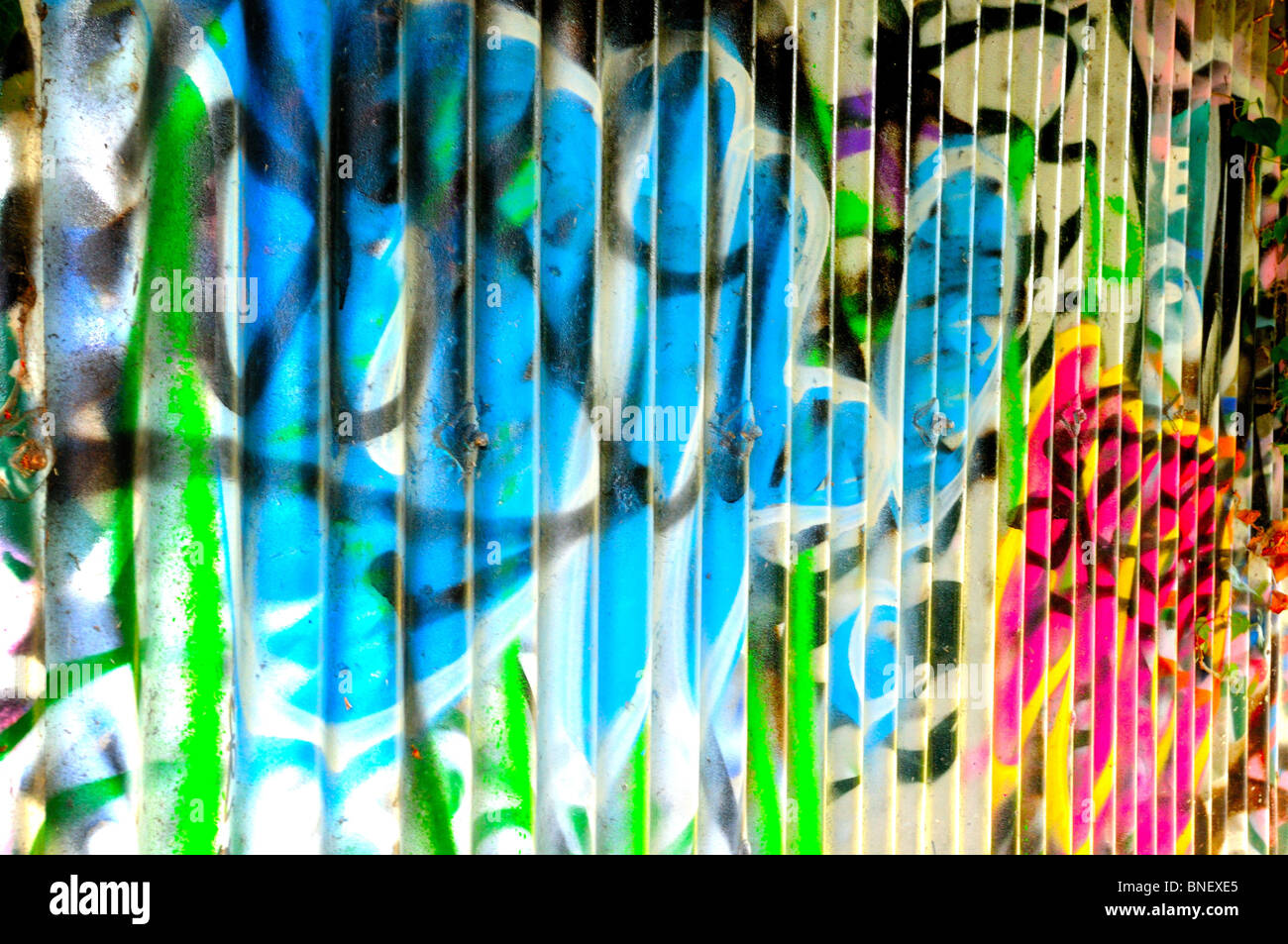 Brightly coloured graffiti on walls Stock Photo - Alamy