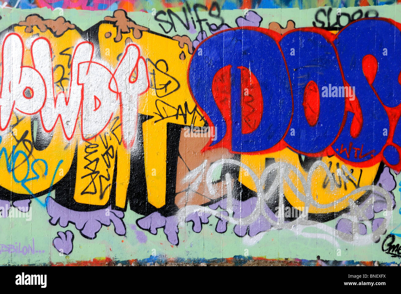 Brightly coloured graffiti on walls Stock Photo - Alamy