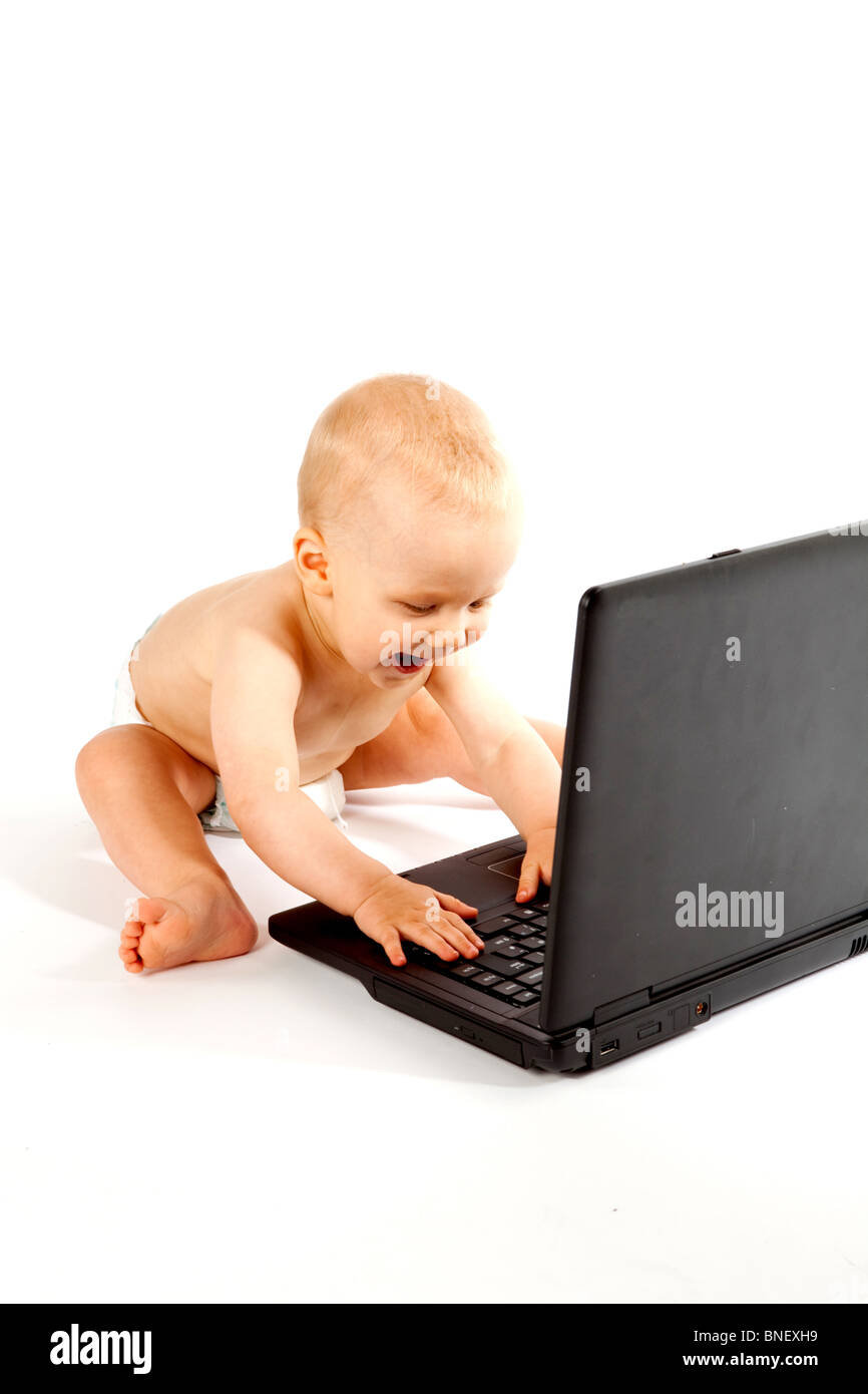 Baby Boy in Diapers Playing with a Computer on a White Isolated ...