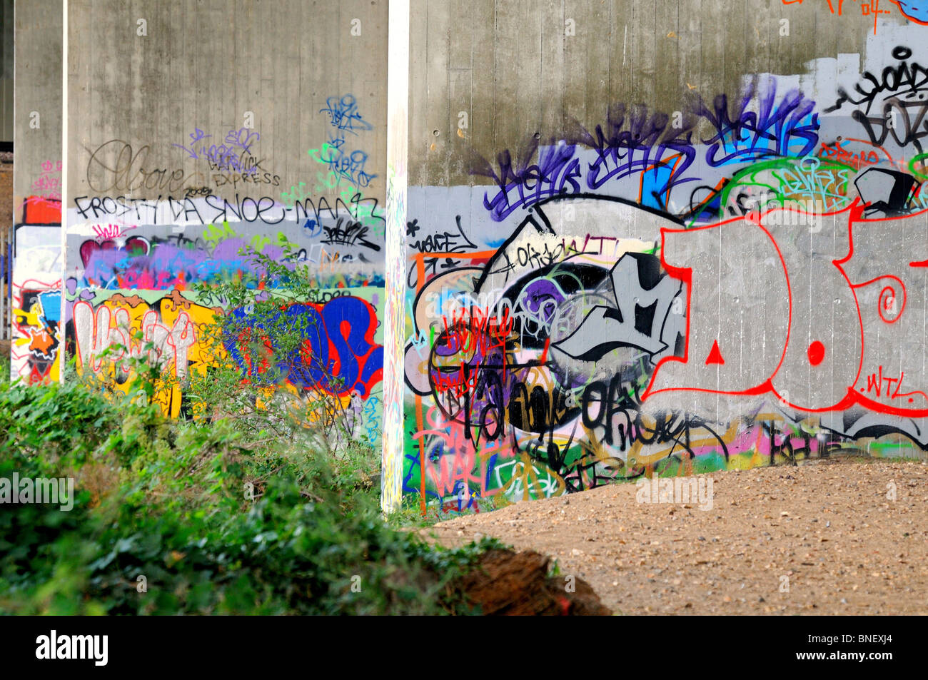 Brightly coloured graffiti on walls Stock Photo - Alamy