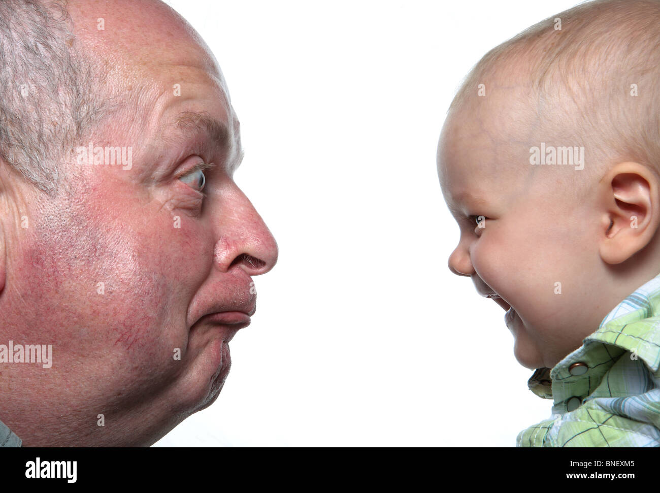 Little Baby Boy Laughing At Aged Man In His Face Stock Photo - Alamy