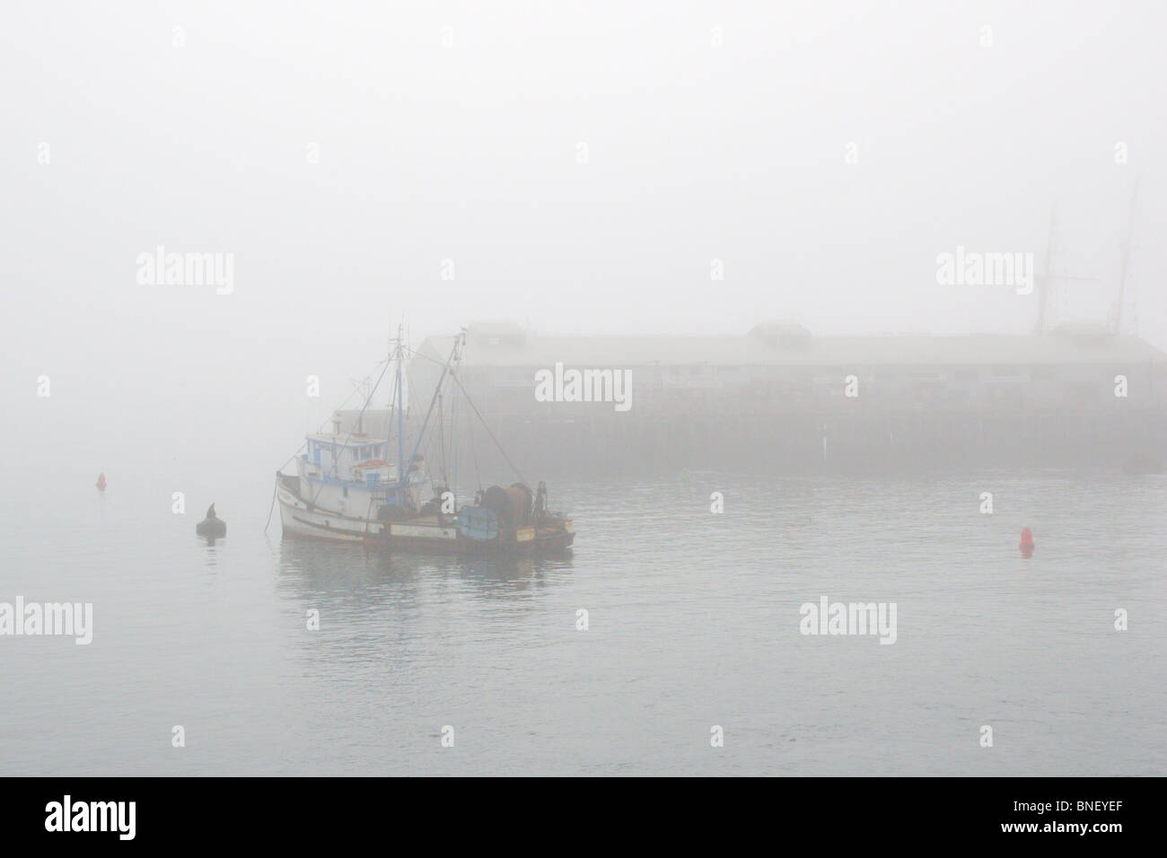 Fishing boat in the mist hi-res stock photography and images - Alamy