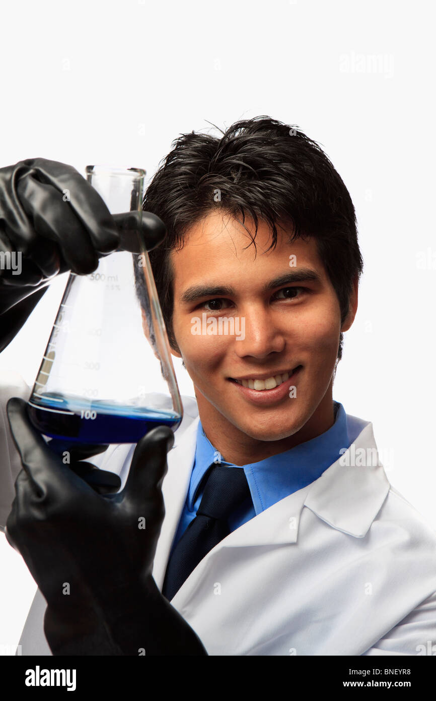 lab technician holding a flask with a fluid inside Stock Photo - Alamy