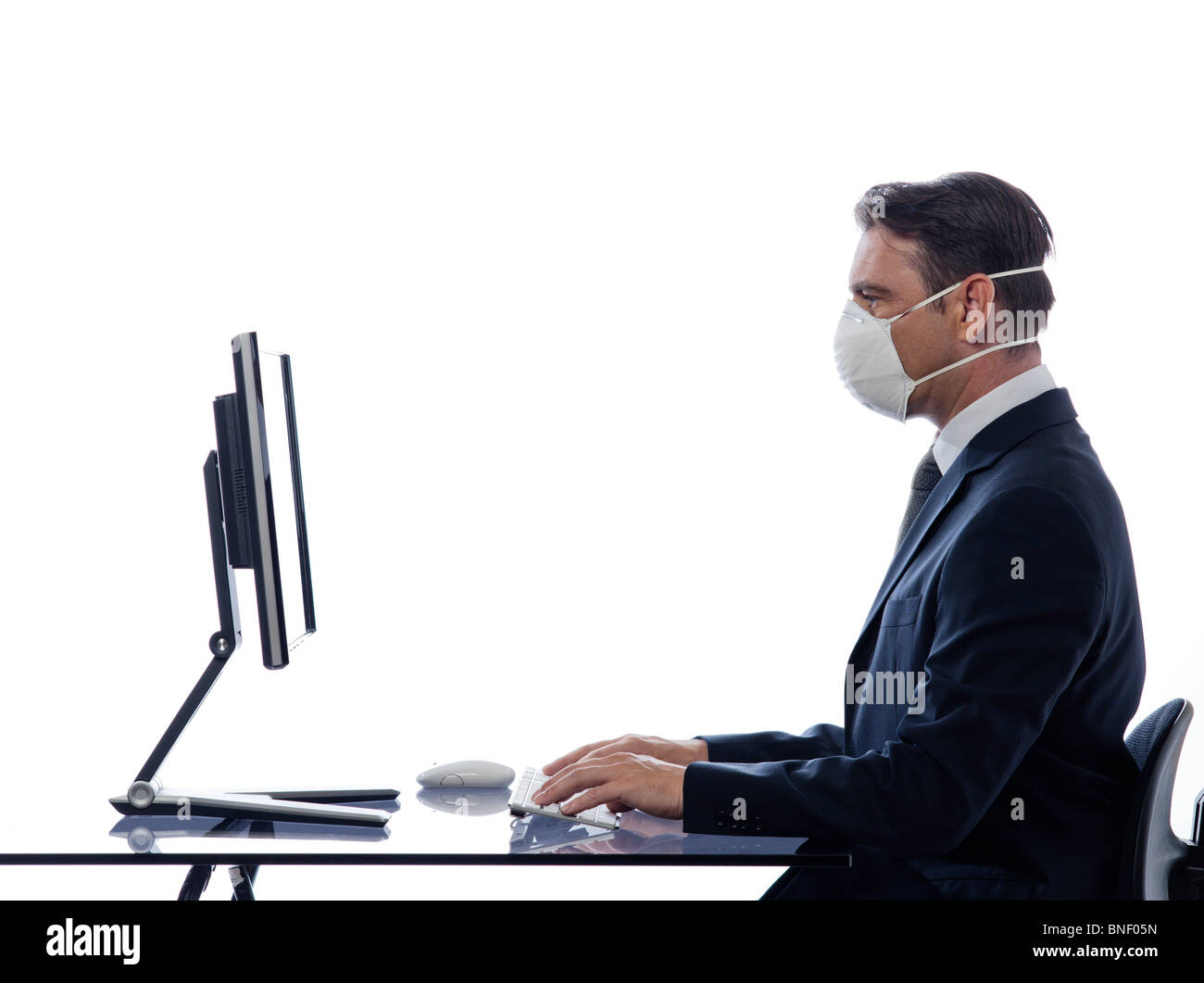 caucasian man cumputing computer wearing protection mask concept ...