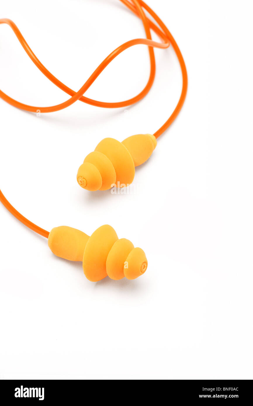 Orange ear plugs isolated on white background Stock Photo - Alamy