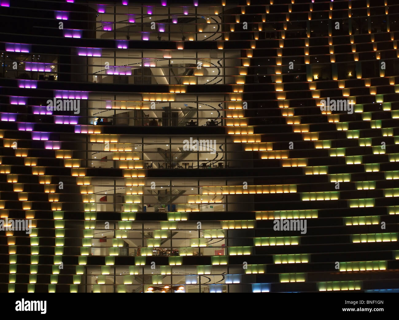 A modern building facade illuminated at night Stock Photo - Alamy