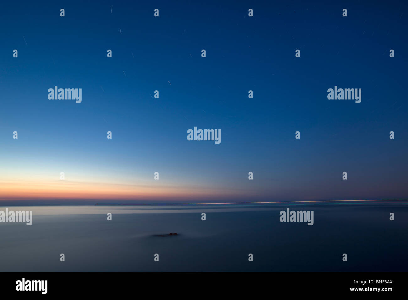 Tuscan sea at dusk Stock Photo - Alamy