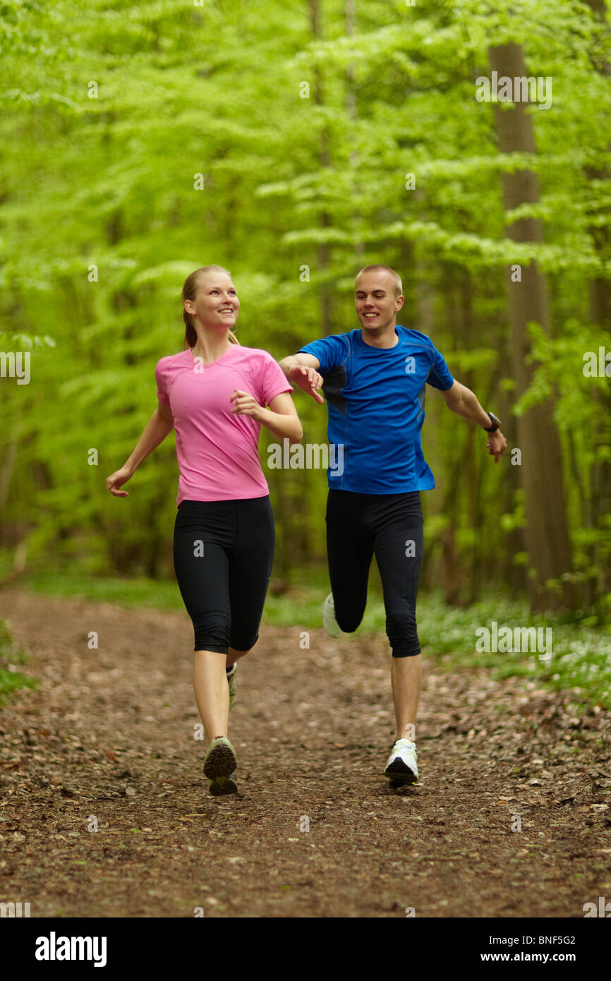 Man and woman running, competing Stock Photo - Alamy
