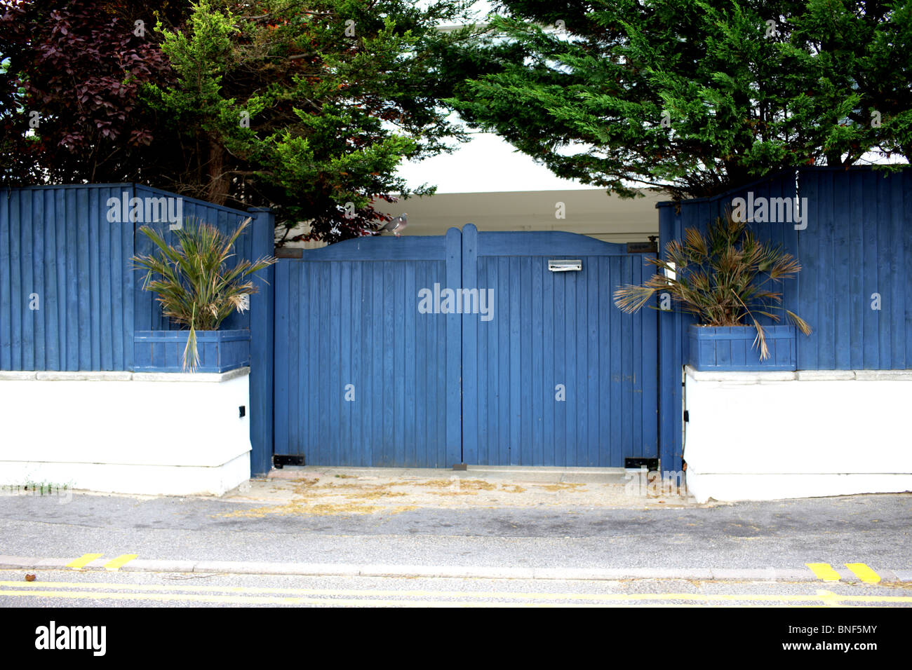 Blue Wooden Gates and Fencing Stock Photo - Alamy