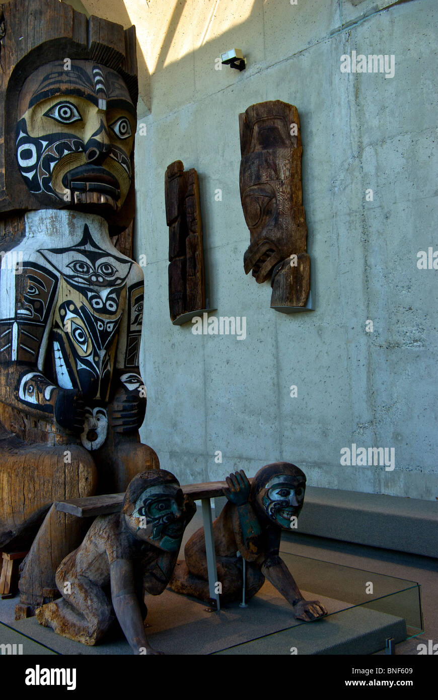 Elaborate carved cedar west coast Aboriginal First Nations totem poles ...