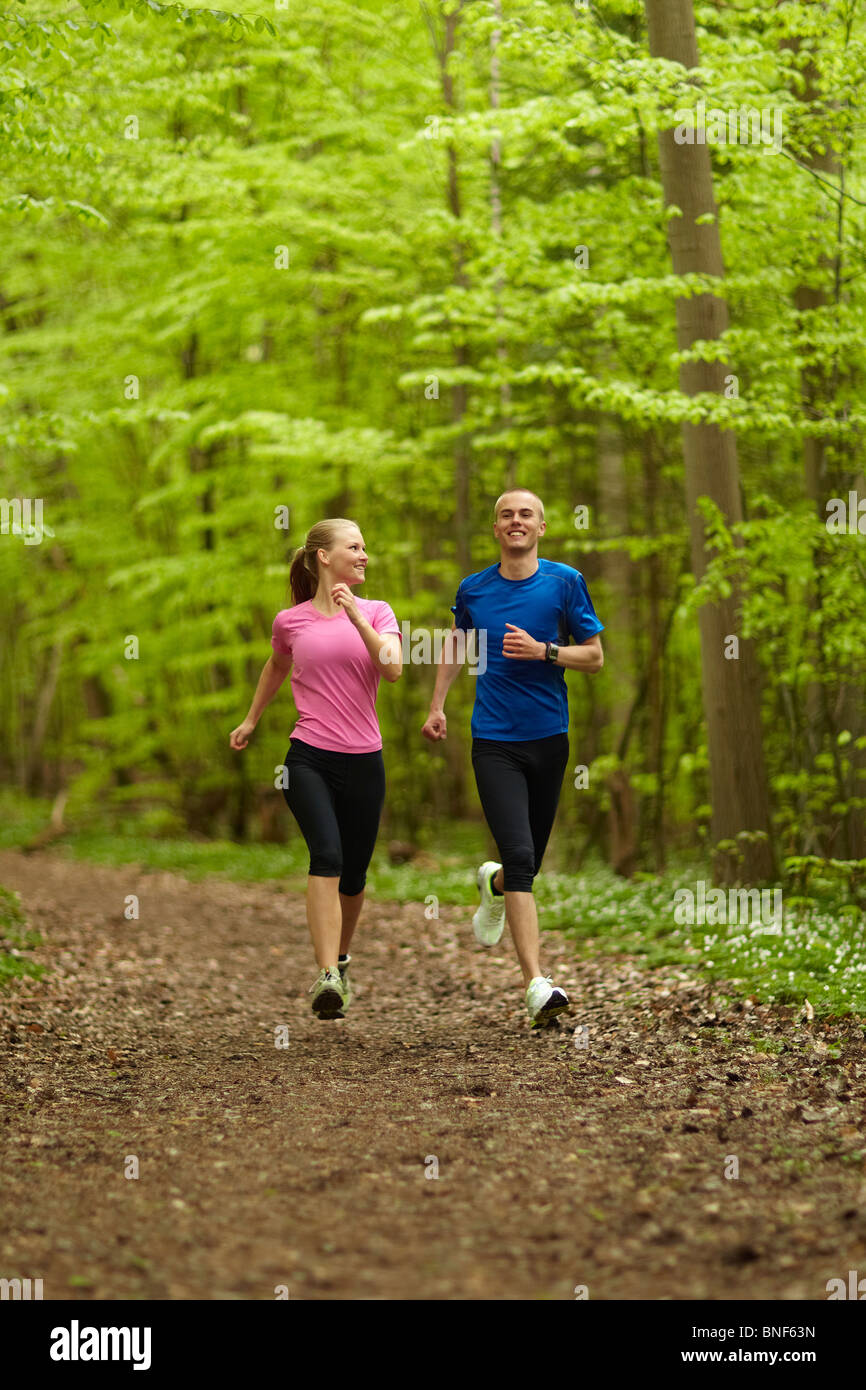 Man and woman running, together Stock Photo - Alamy