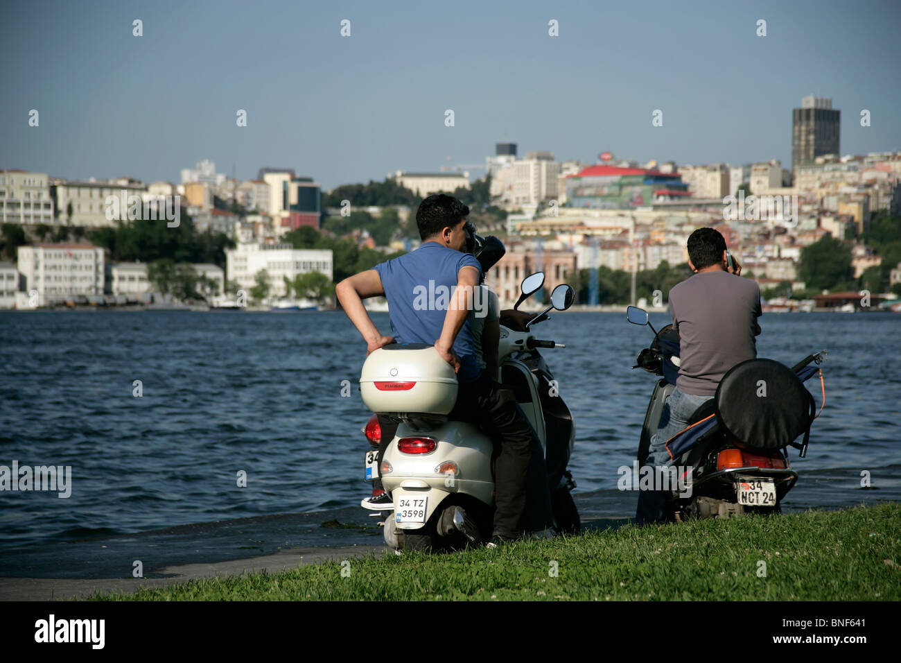 Turkish boys on motorbikes by the Golden Horn, Istanbul, Turkey Stock ...