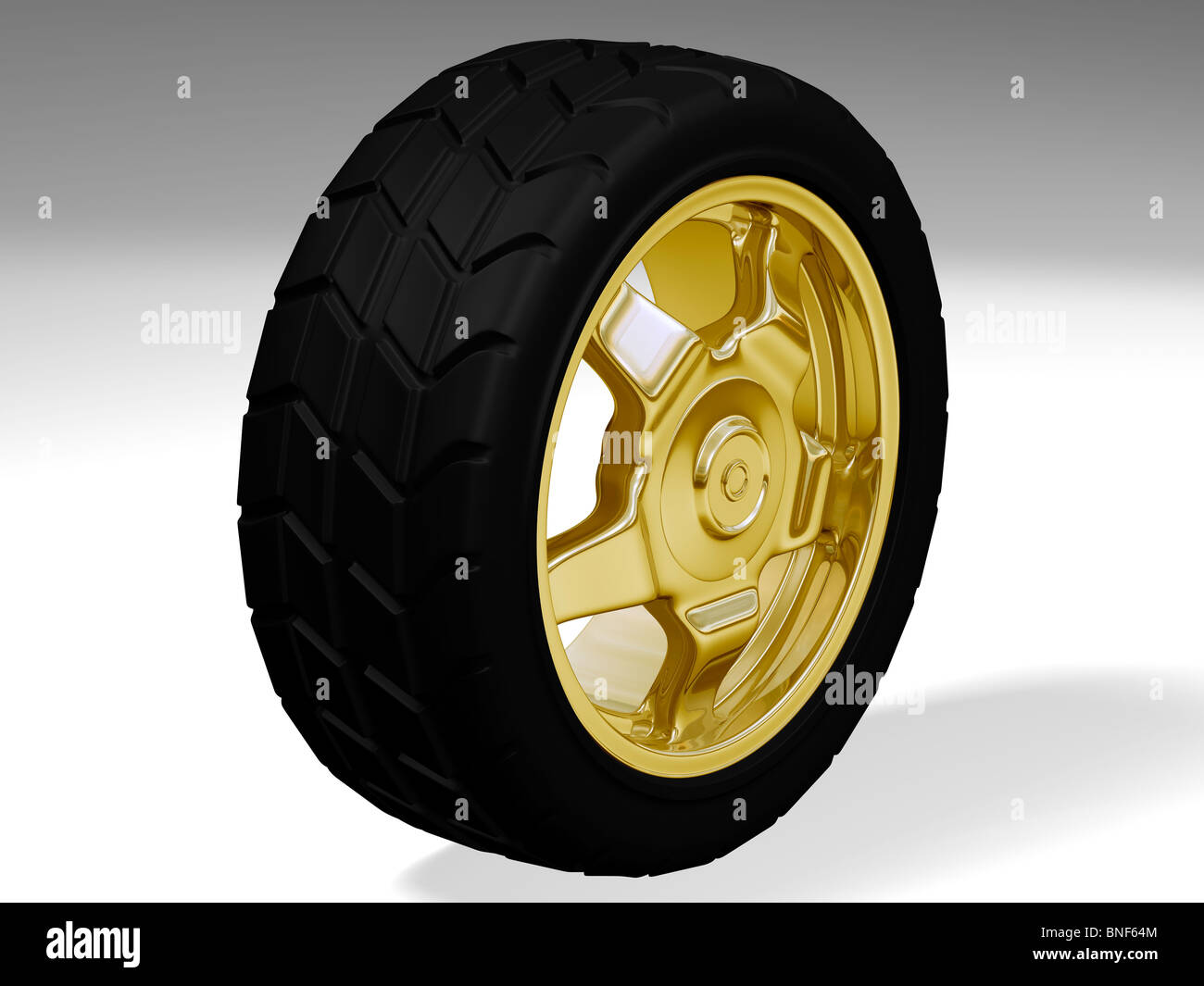 Big golden alloy wheel with sport tyre Stock Photo - Alamy