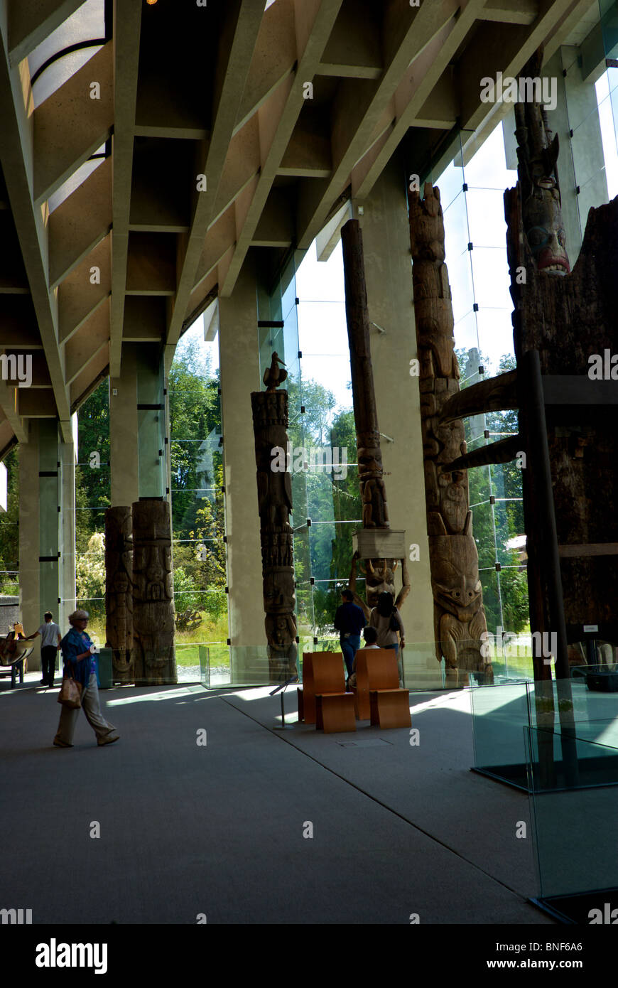 Visitors in Grand west coast Aboriginal First Nations totem pole ...