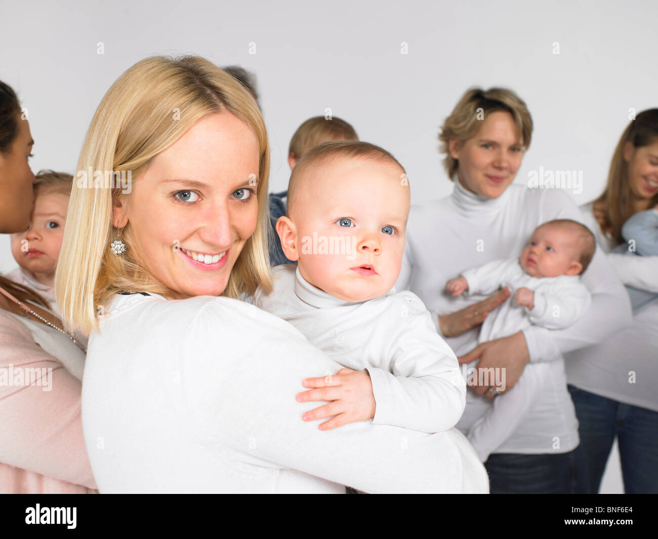 Group of mothers and babies Stock Photo - Alamy