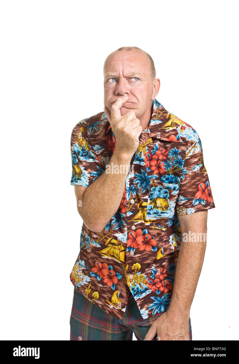 Expressive old man in loud shirt holiday concept isolated against white ...