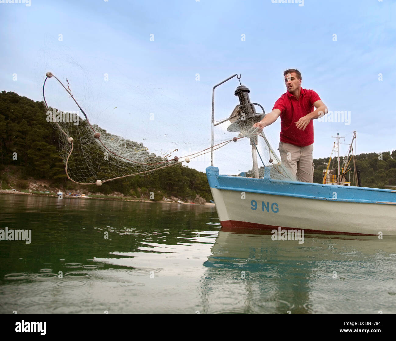 Throwing cast net hi-res stock photography and images - Alamy