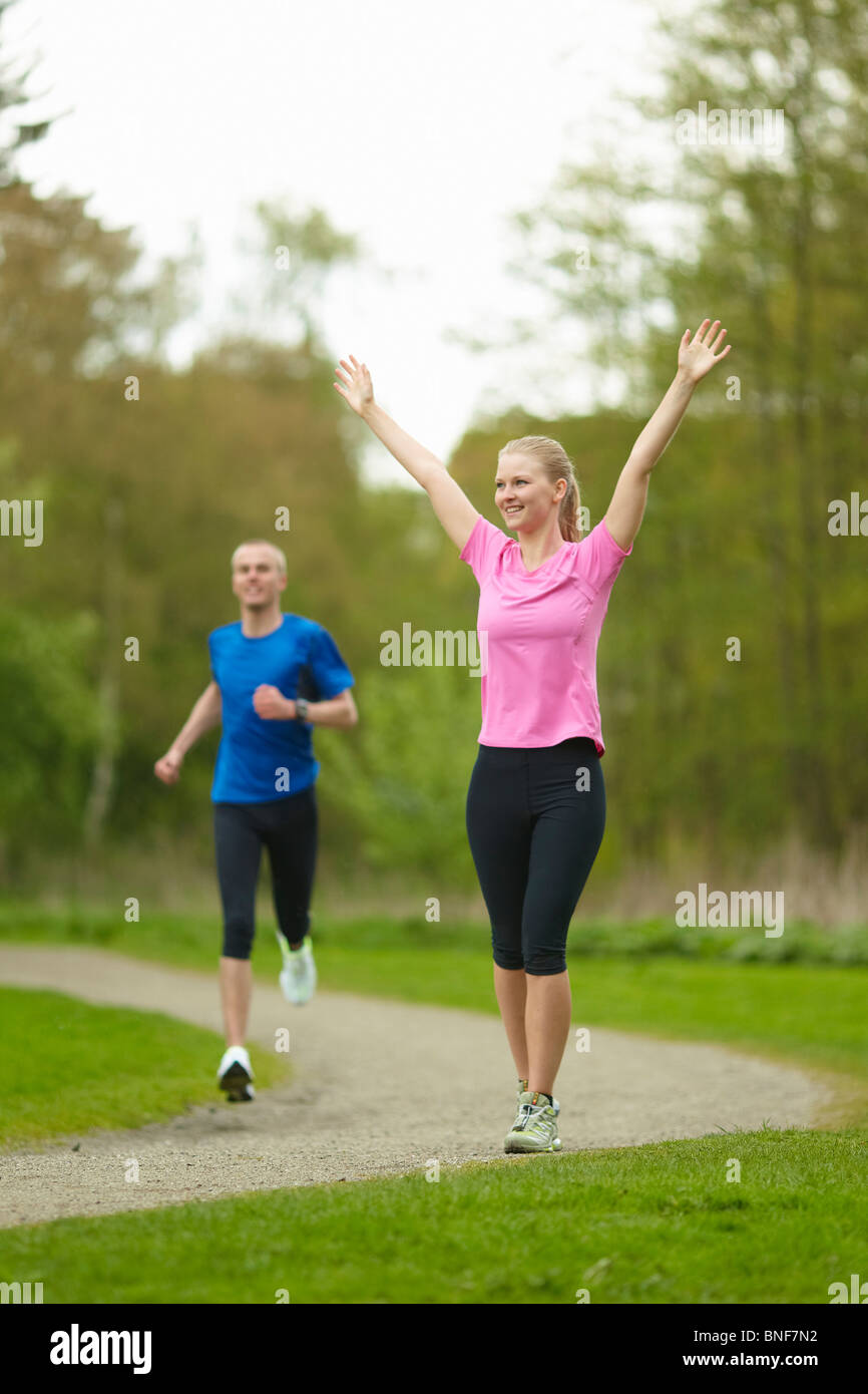 Man and woman running, competing Stock Photo - Alamy