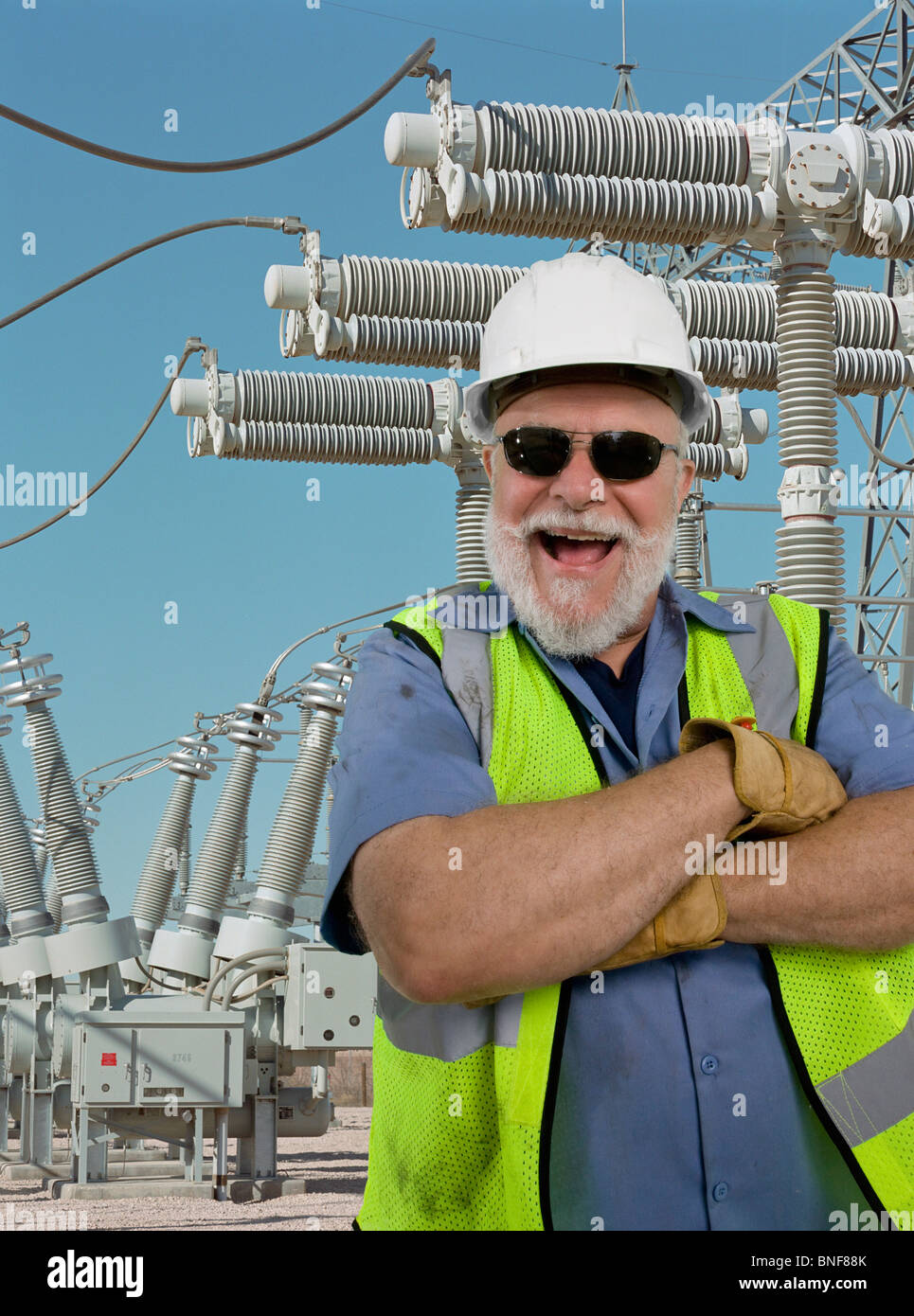 Engineer smiling with his arms crossed Stock Photo - Alamy