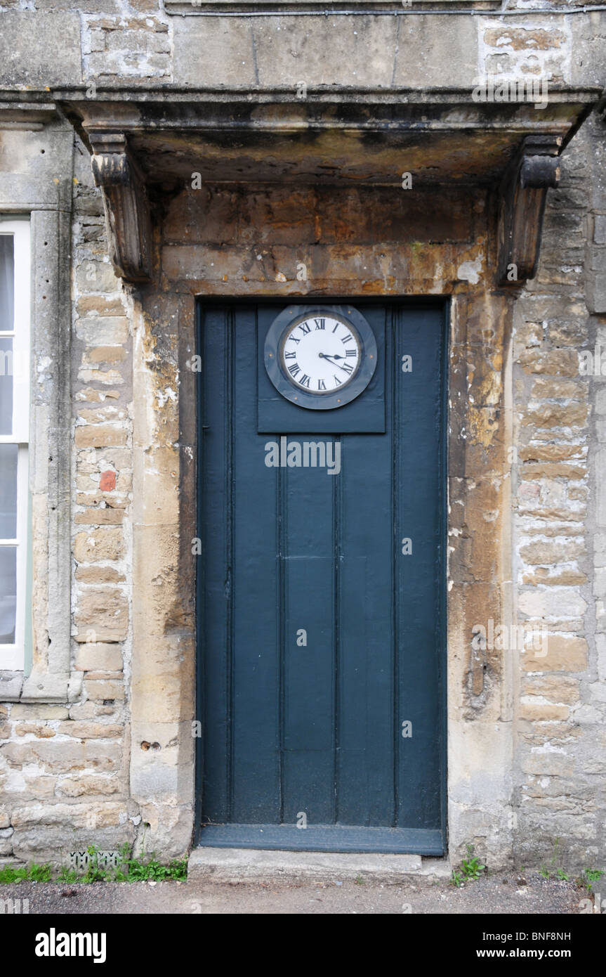Clock in doorway, Lacock, Wiltshire Stock Photo - Alamy