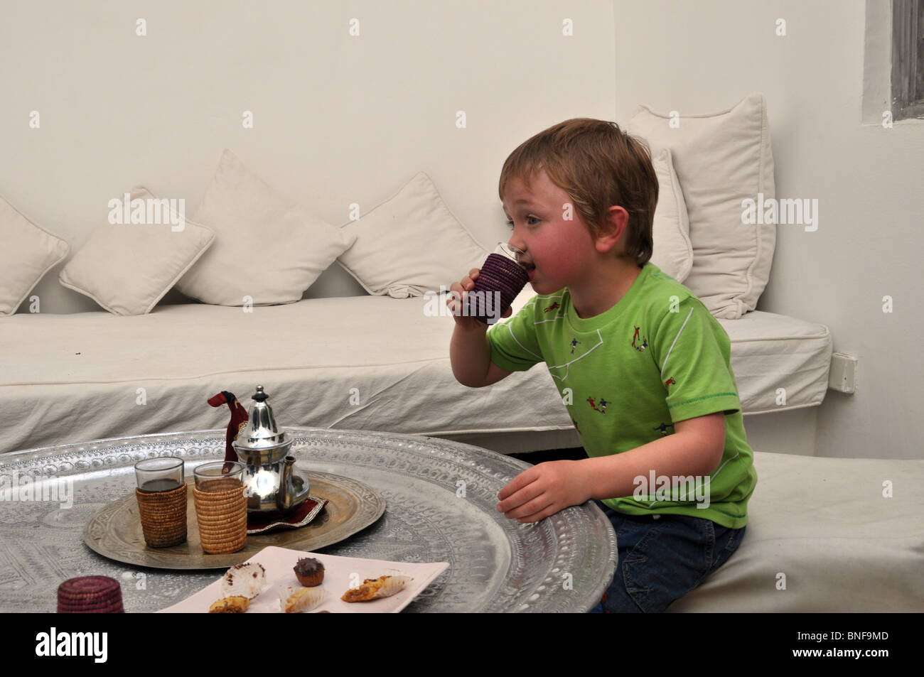 Boy taking tea hi-res stock photography and images - Alamy