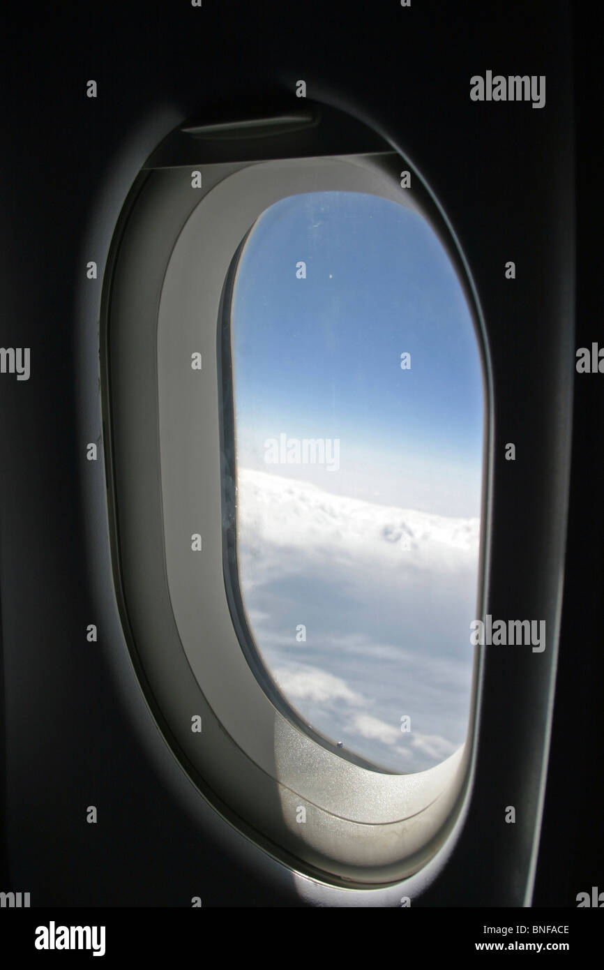 The view through a commercial jet window in flight Stock Photo - Alamy